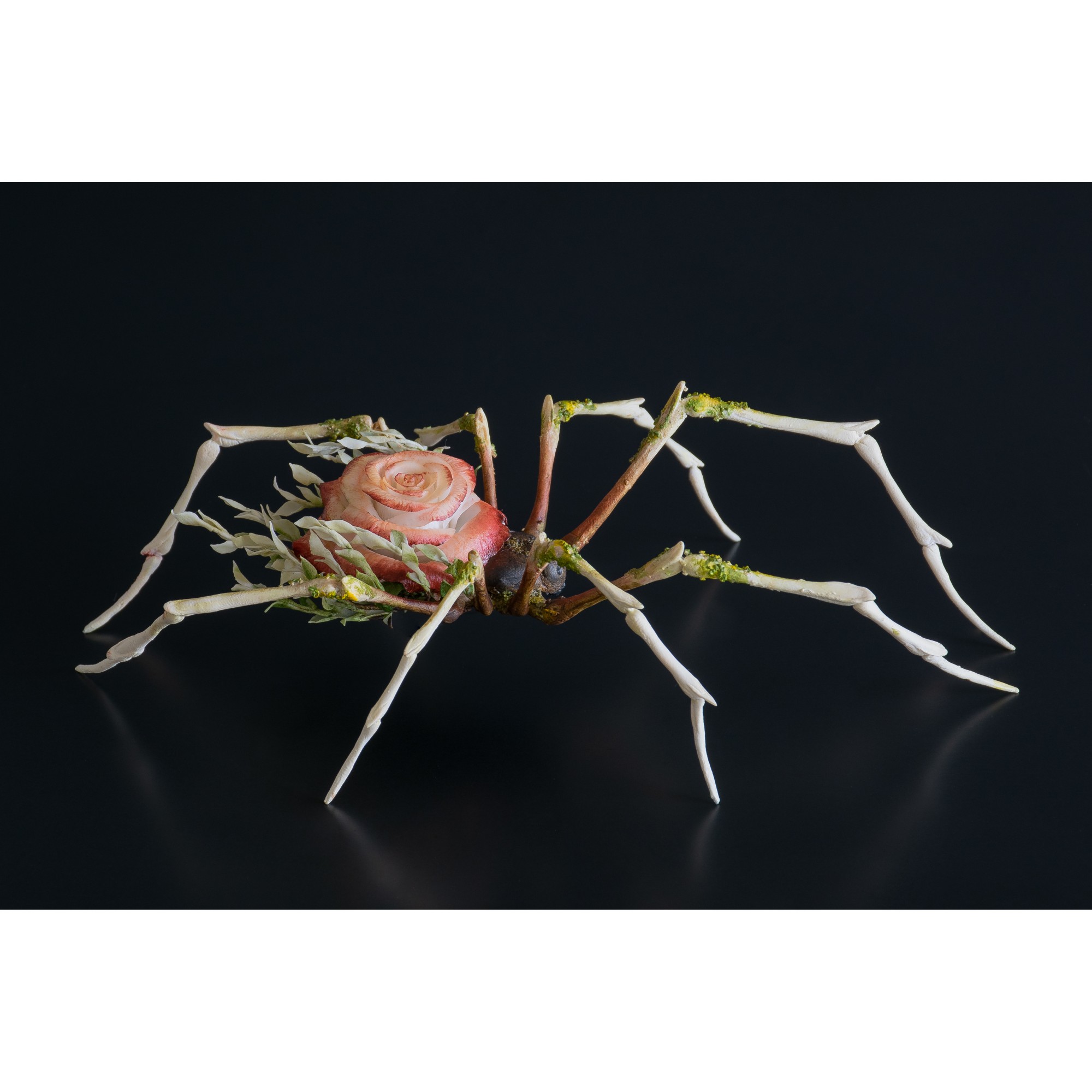 Collectible Handmade spider sculpture with a rose made of air clay.