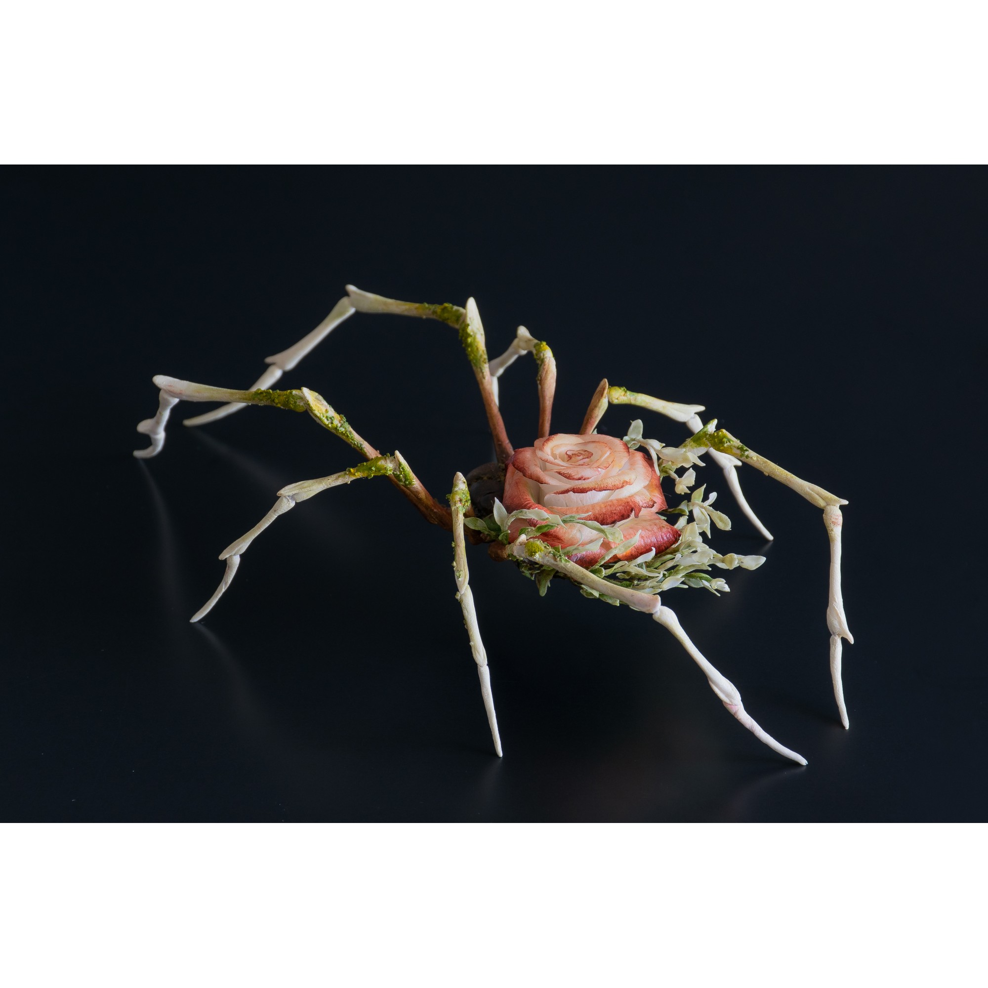 Collectible Handmade spider sculpture with a rose made of air clay.