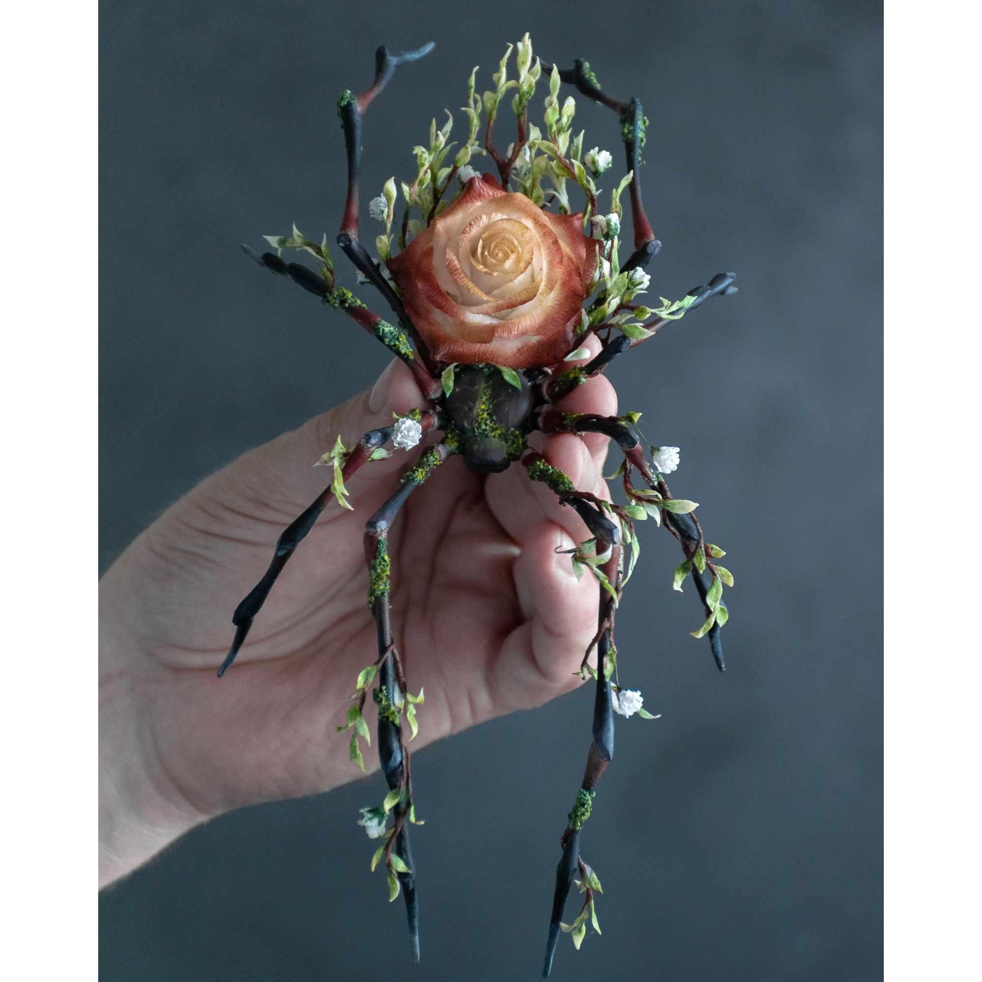 Collectible Handmade black spider sculpture with a rose