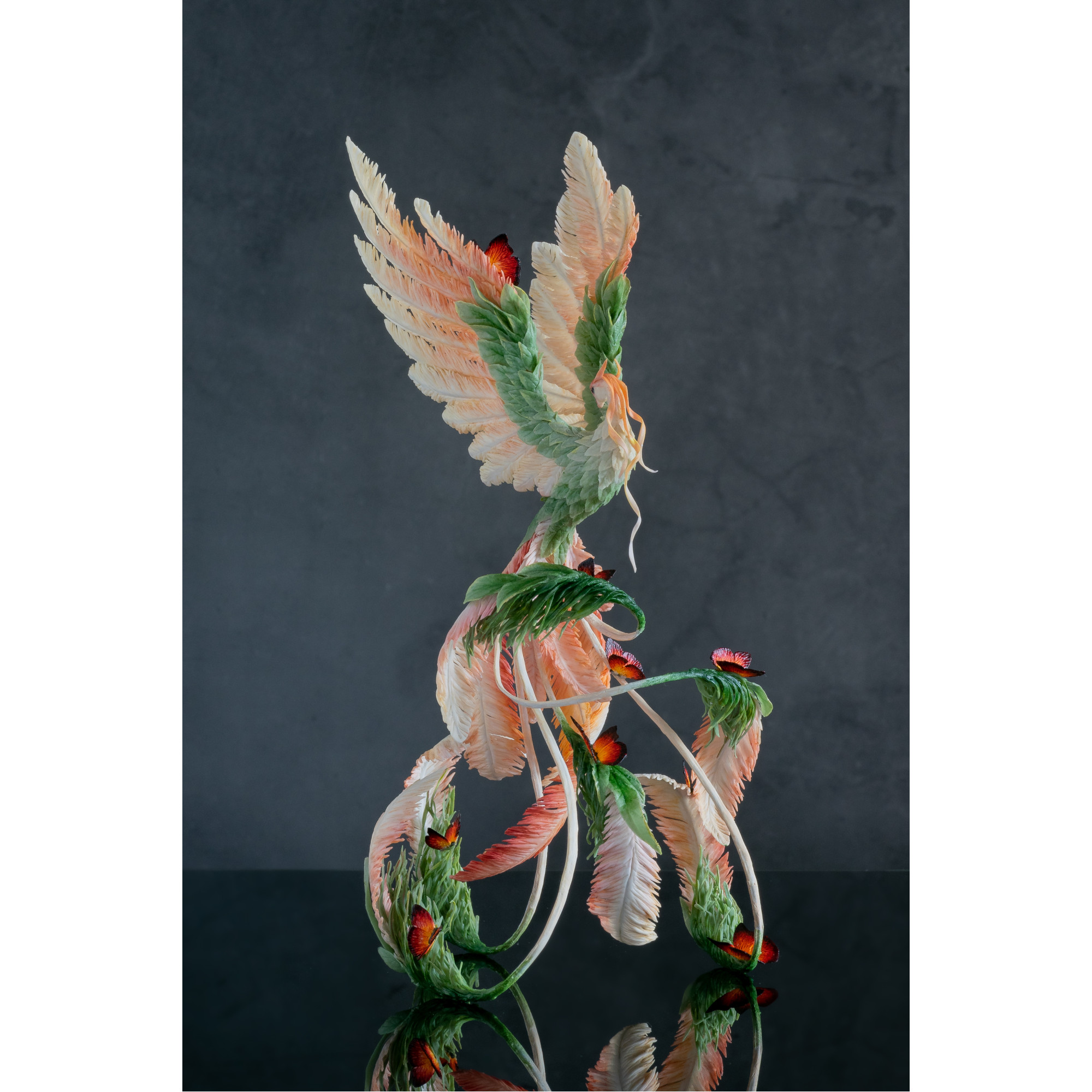 Collectible phoenix statue bird with fire butterfly . Fire bird