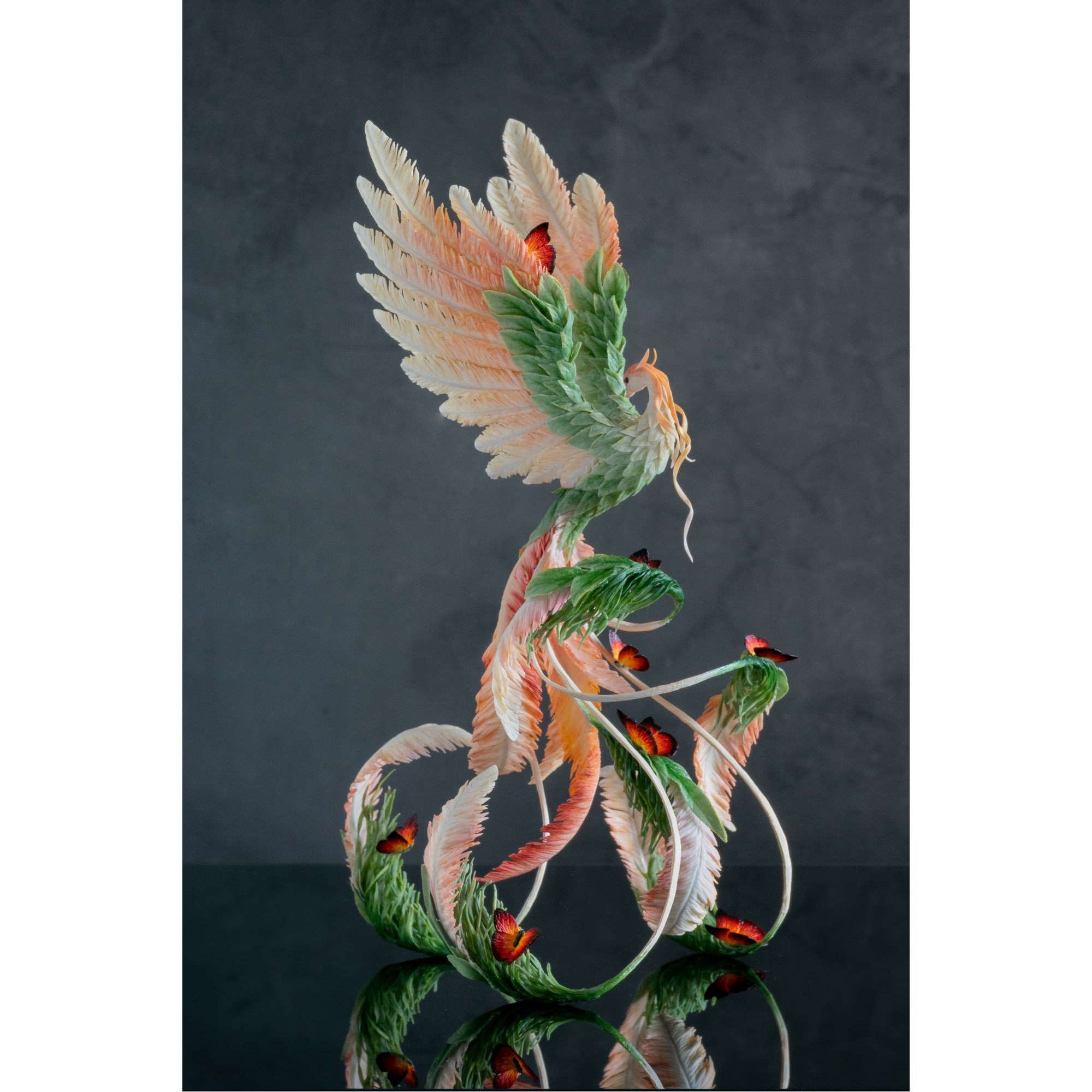 Collectible phoenix statue bird with fire butterfly . Fire bird