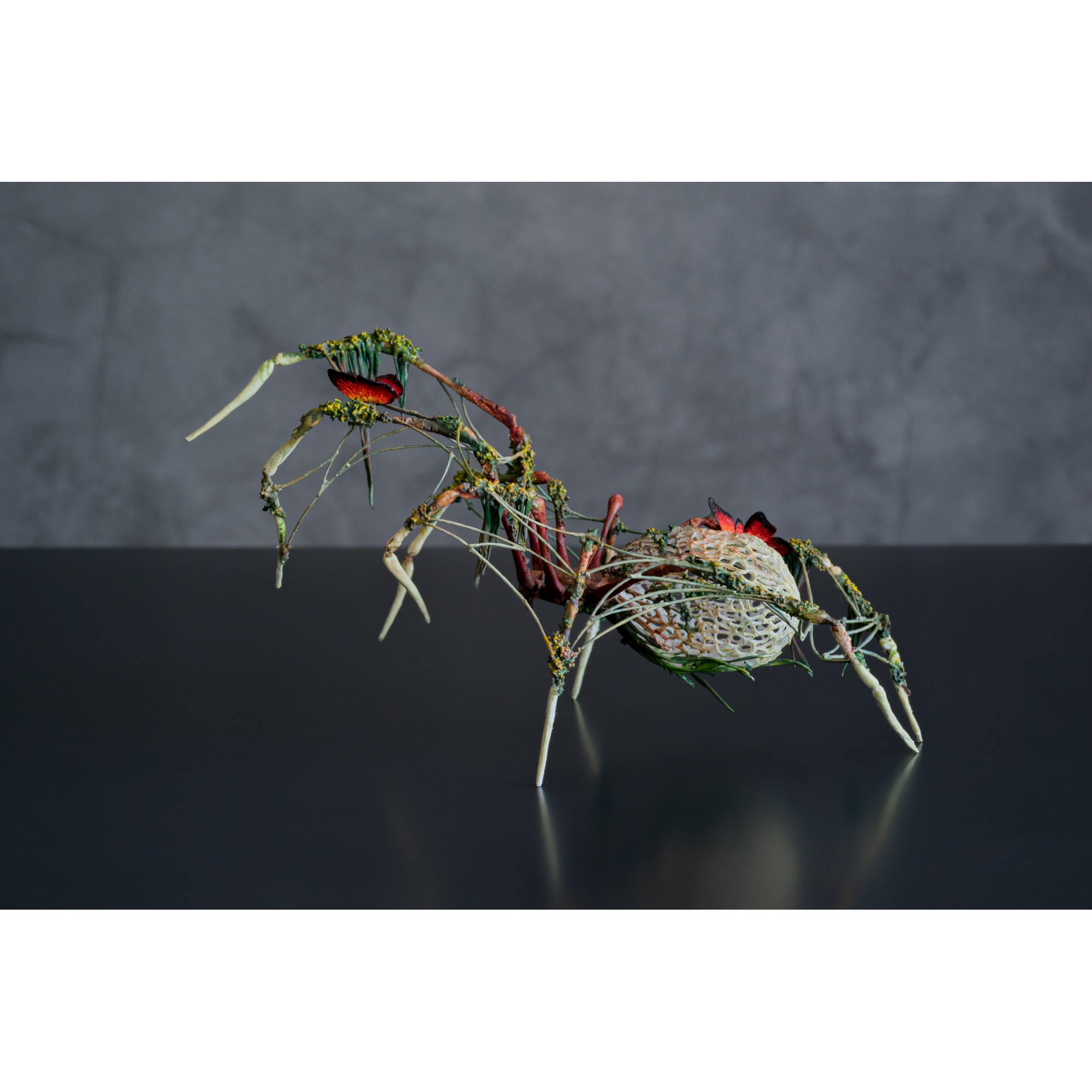 Collectible Handmade black spider sculpture with a fire butterfly. OOAK