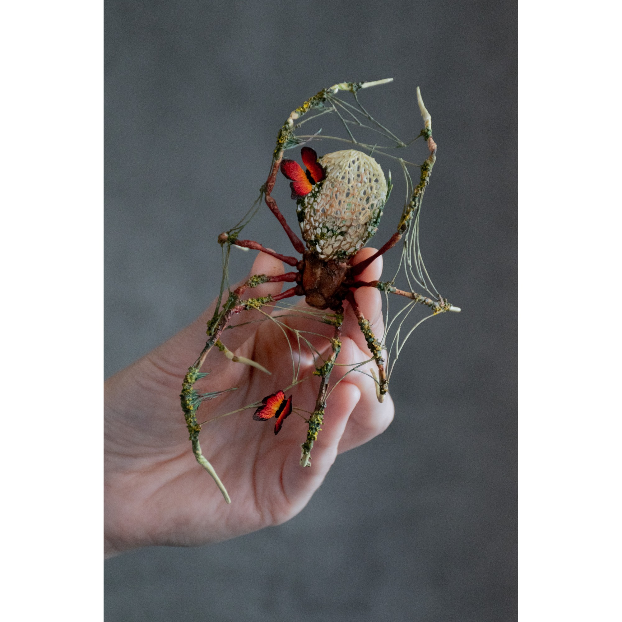 Collectible Handmade black spider sculpture with a fire butterfly. OOAK
