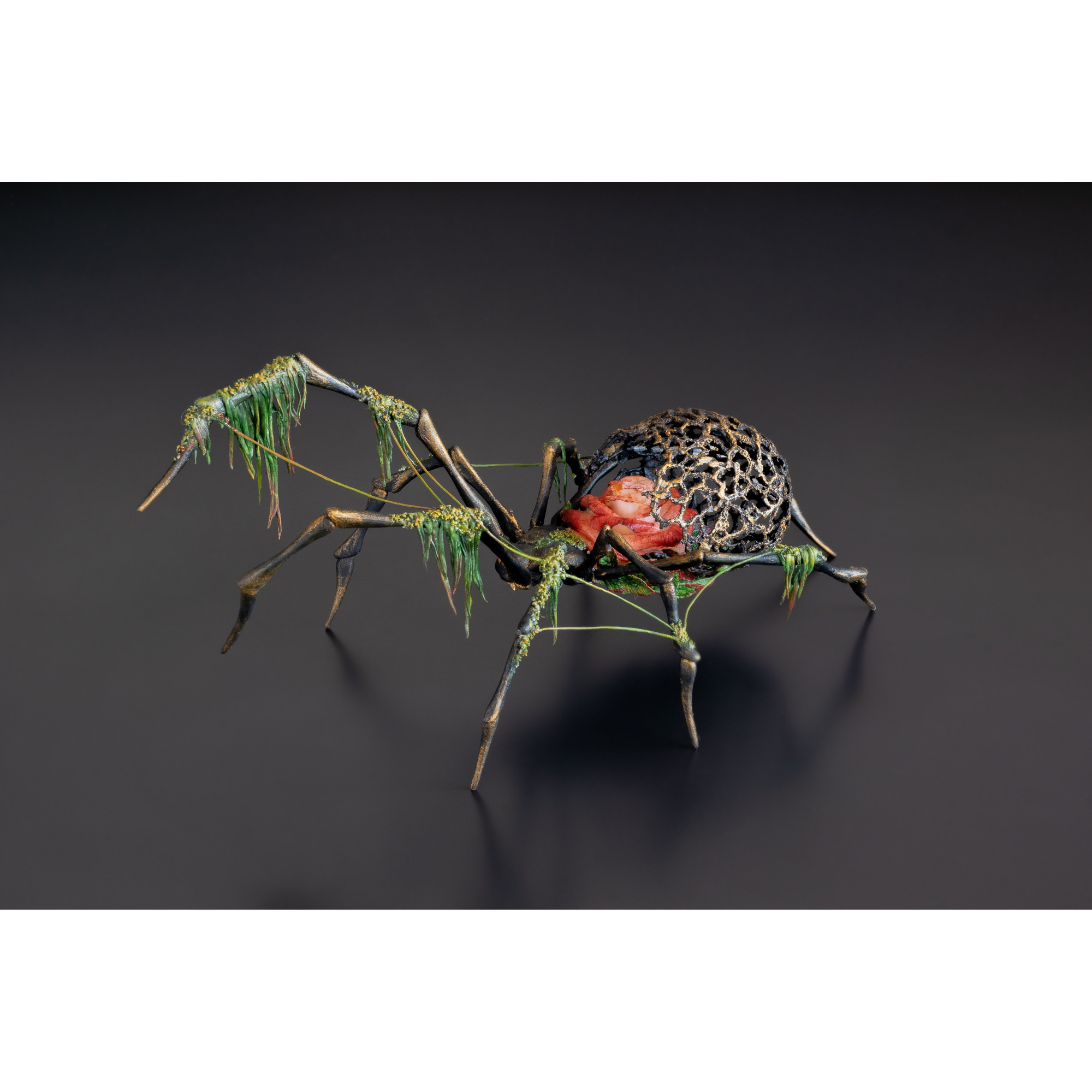 Collectible Handmade black spider sculpture with a rose