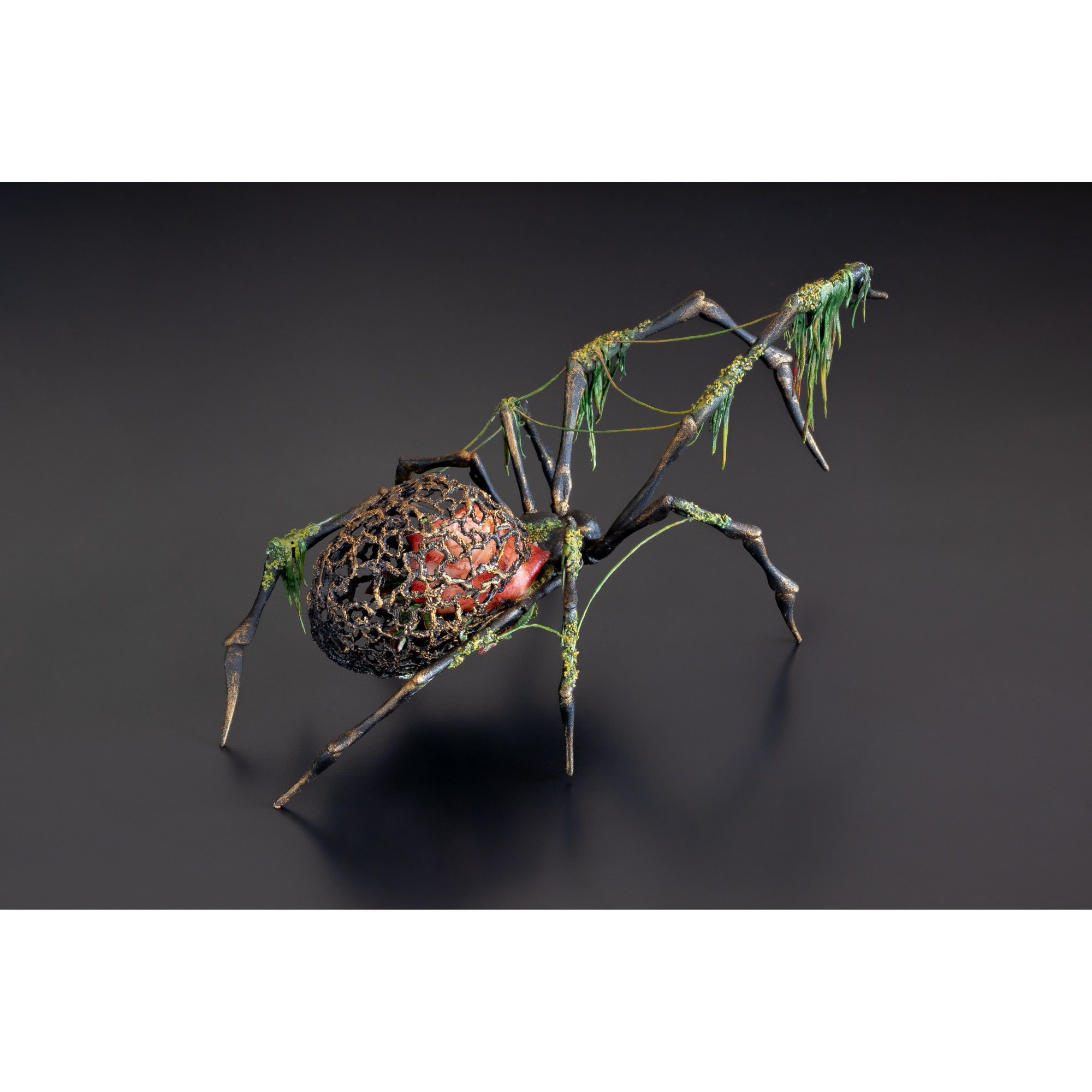 Collectible Handmade black spider sculpture with a rose