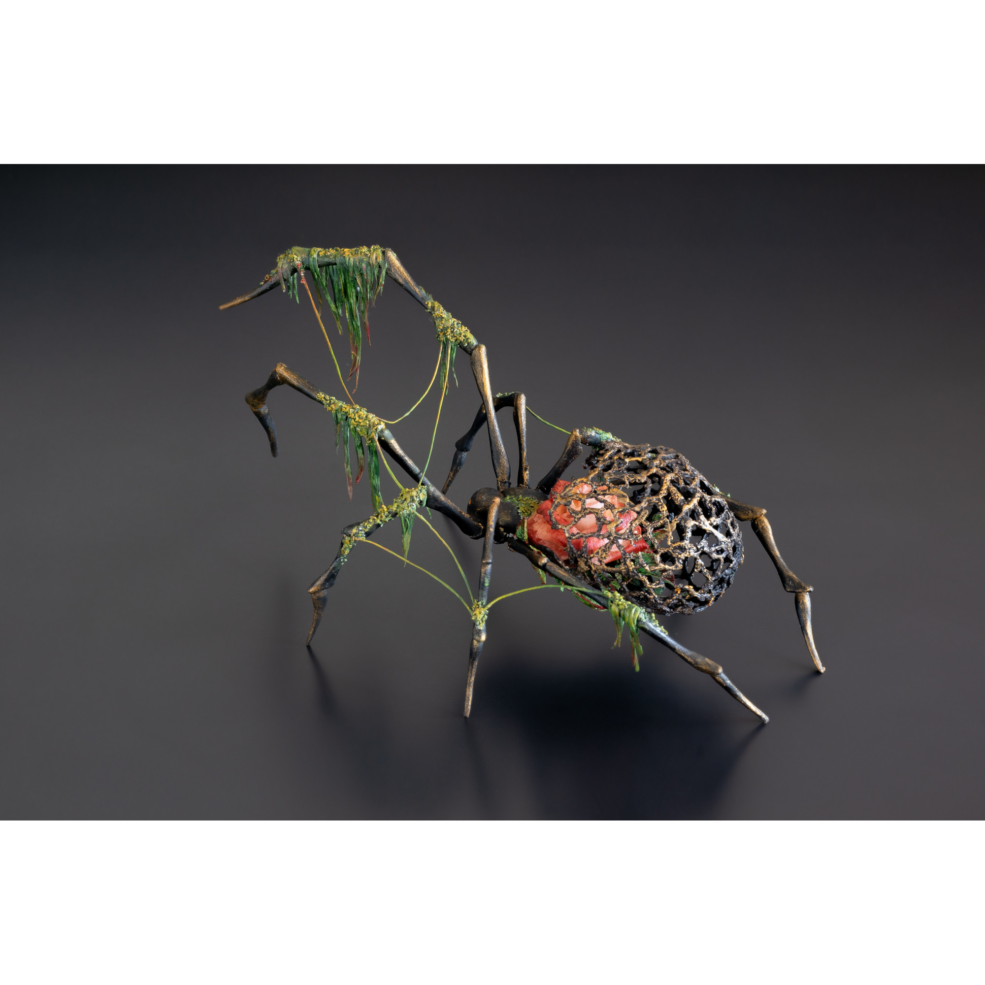 Collectible Handmade black spider sculpture with a rose