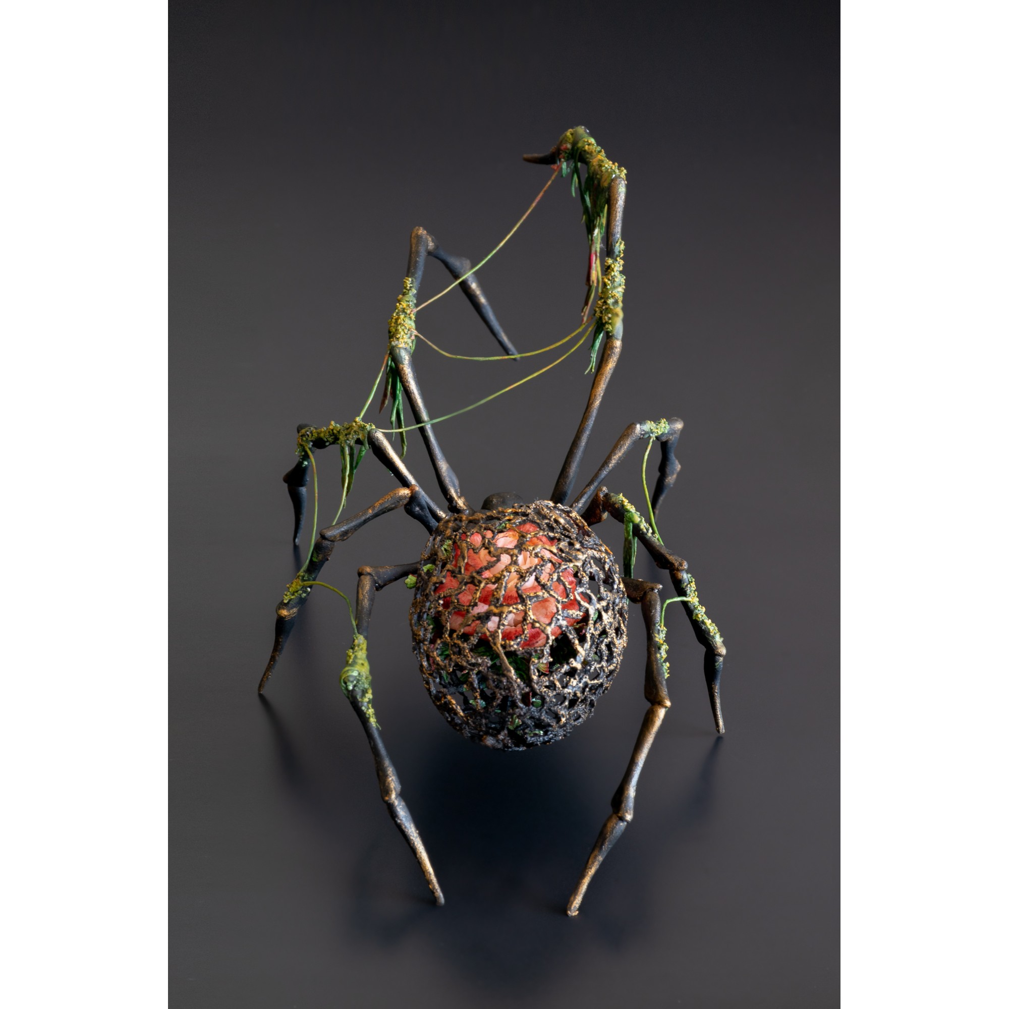 Collectible Handmade black spider sculpture with a rose