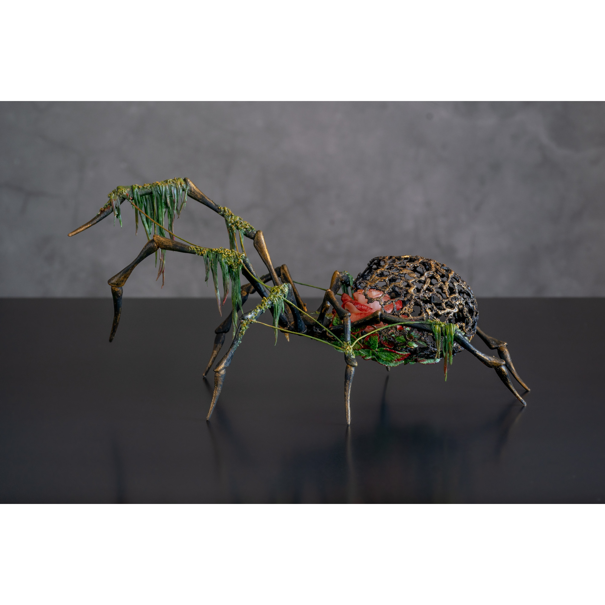 Collectible Handmade black spider sculpture with a rose