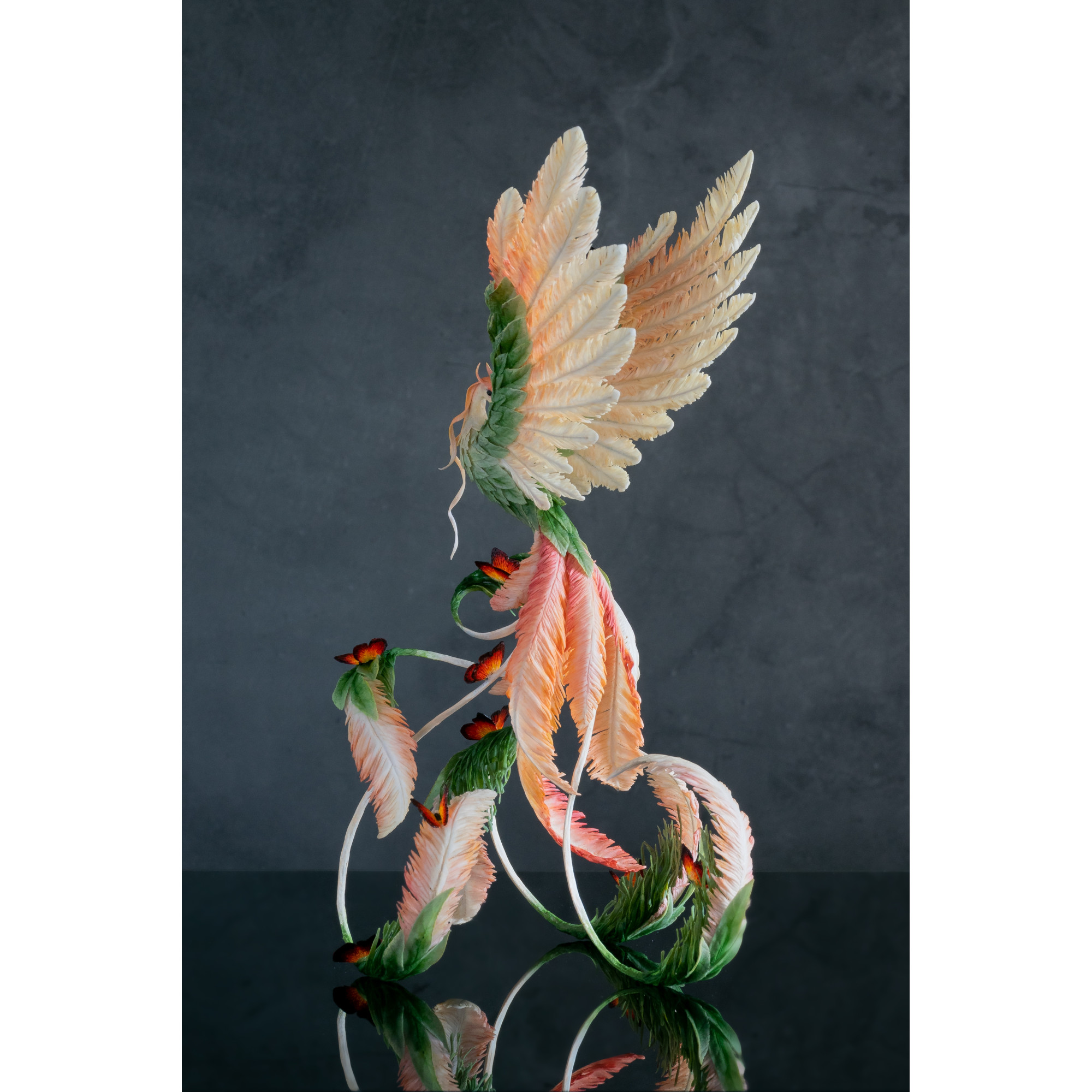 Collectible phoenix statue bird with fire butterfly . Fire bird