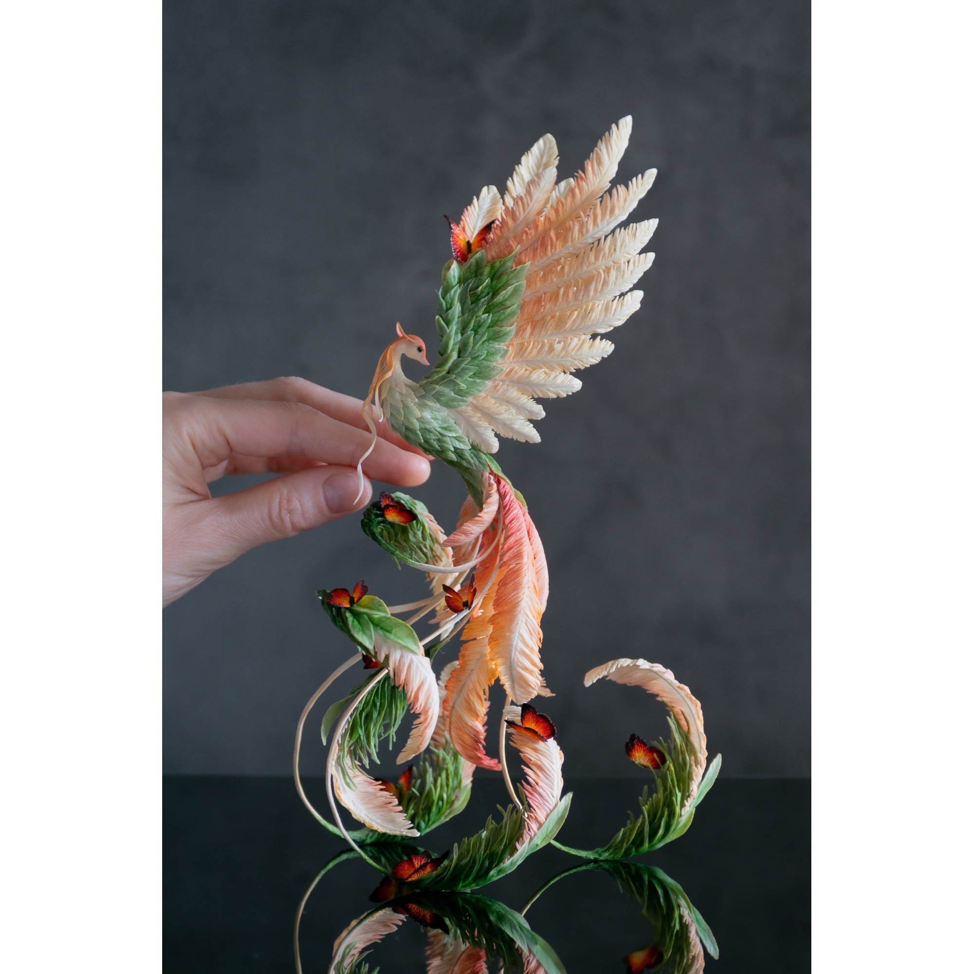 Collectible phoenix statue bird with fire butterfly . Fire bird