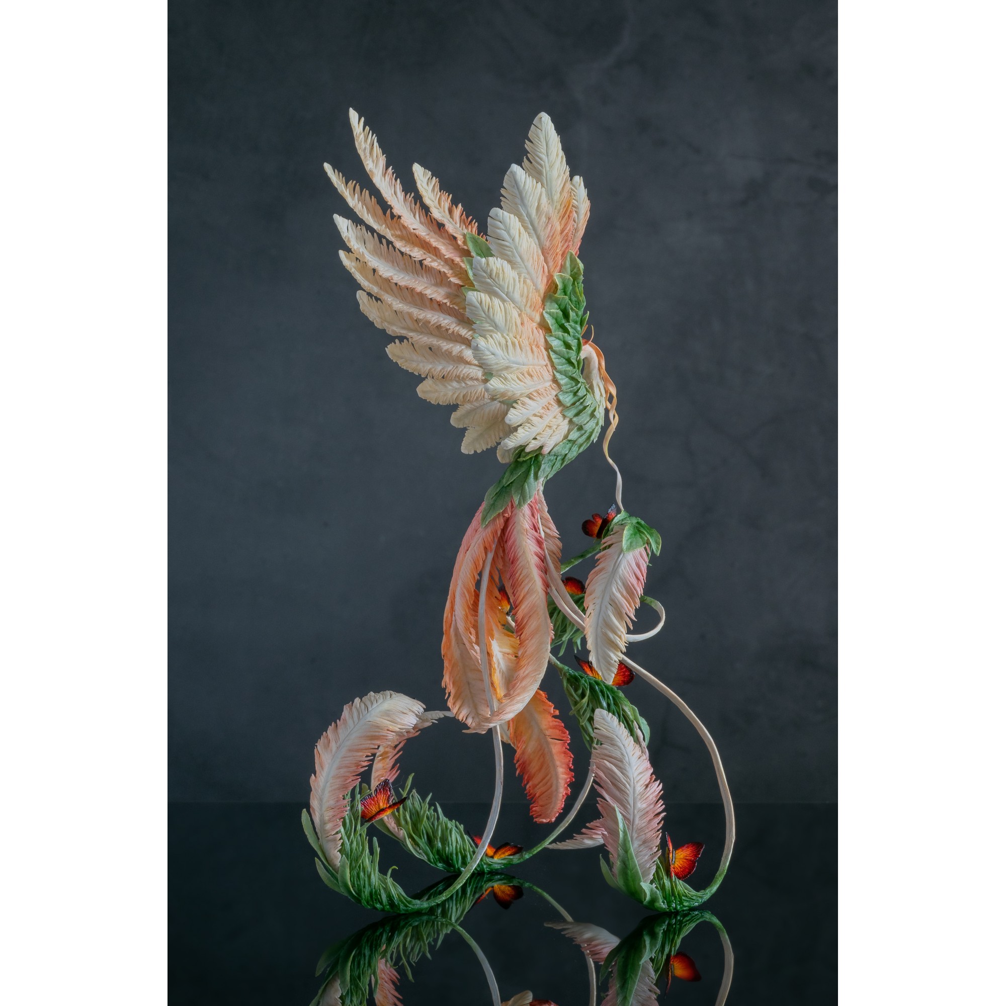 Collectible phoenix statue bird with fire butterfly . Fire bird